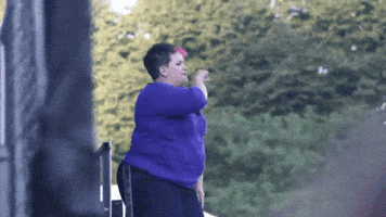 Female sign language lady signals...’Throw High Heat’ | Radio Gunk